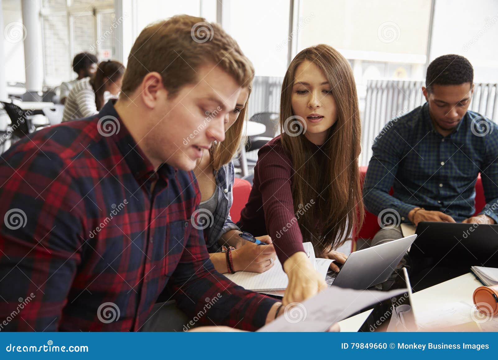 Group of Students in Library Collaborating on Project Stock Photo ...