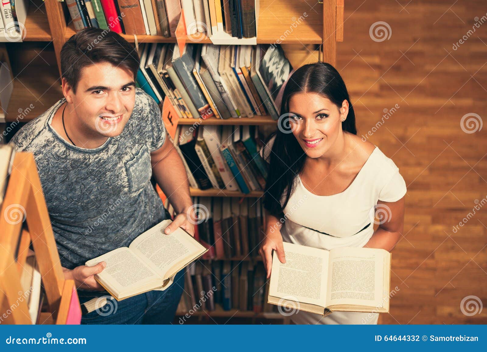 Group of Students in Library Reading Books - Study Group Stock Photo ...
