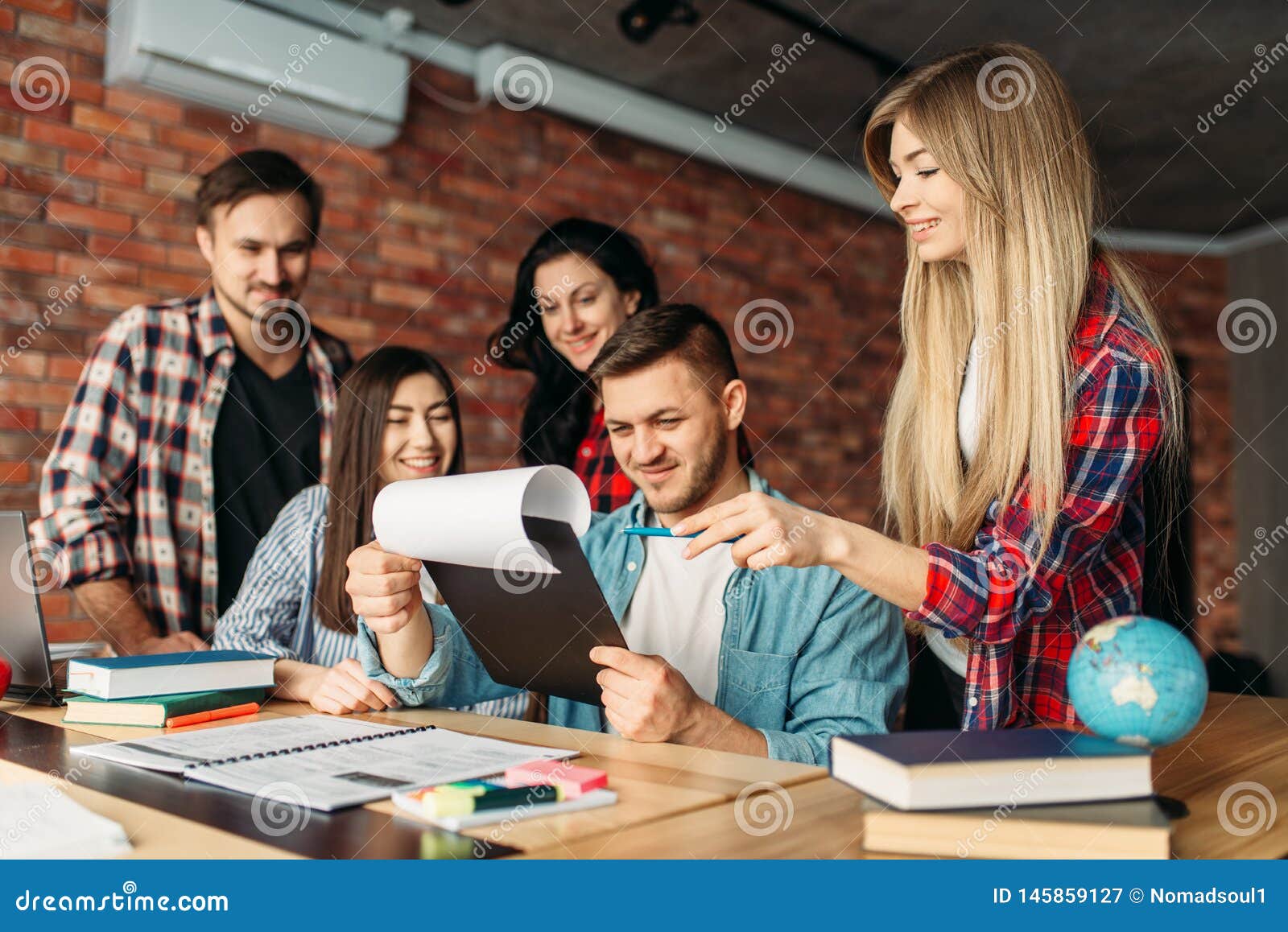 Group of Students Looking on Laptop Together Stock Image - Image of ...