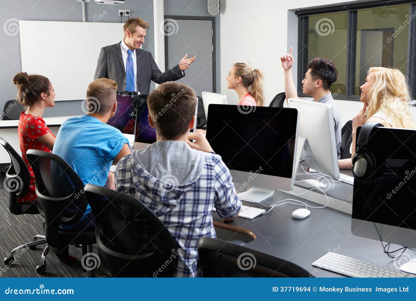 Group of Students with Male Tutor in Computer Class Stock Photo - Image ...