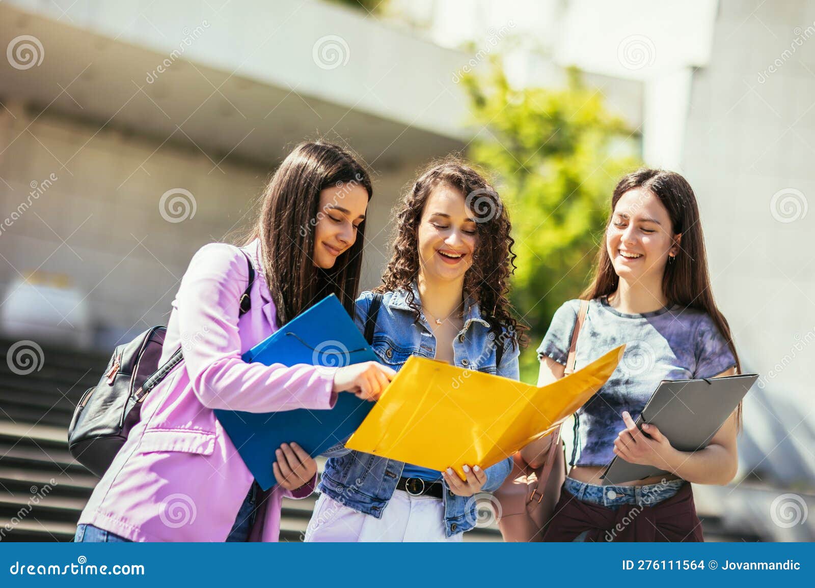 Students with Notebook Studying Together Outdoors Stock Photo - Image ...