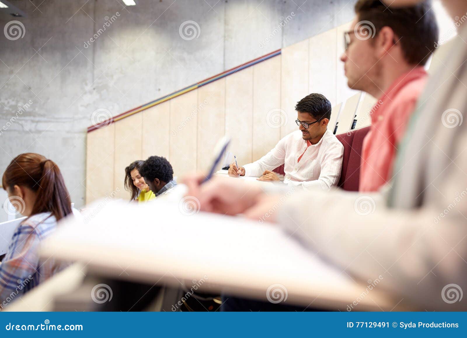 Group of Students with Notebooks in Lecture Hall Stock Image - Image of ...