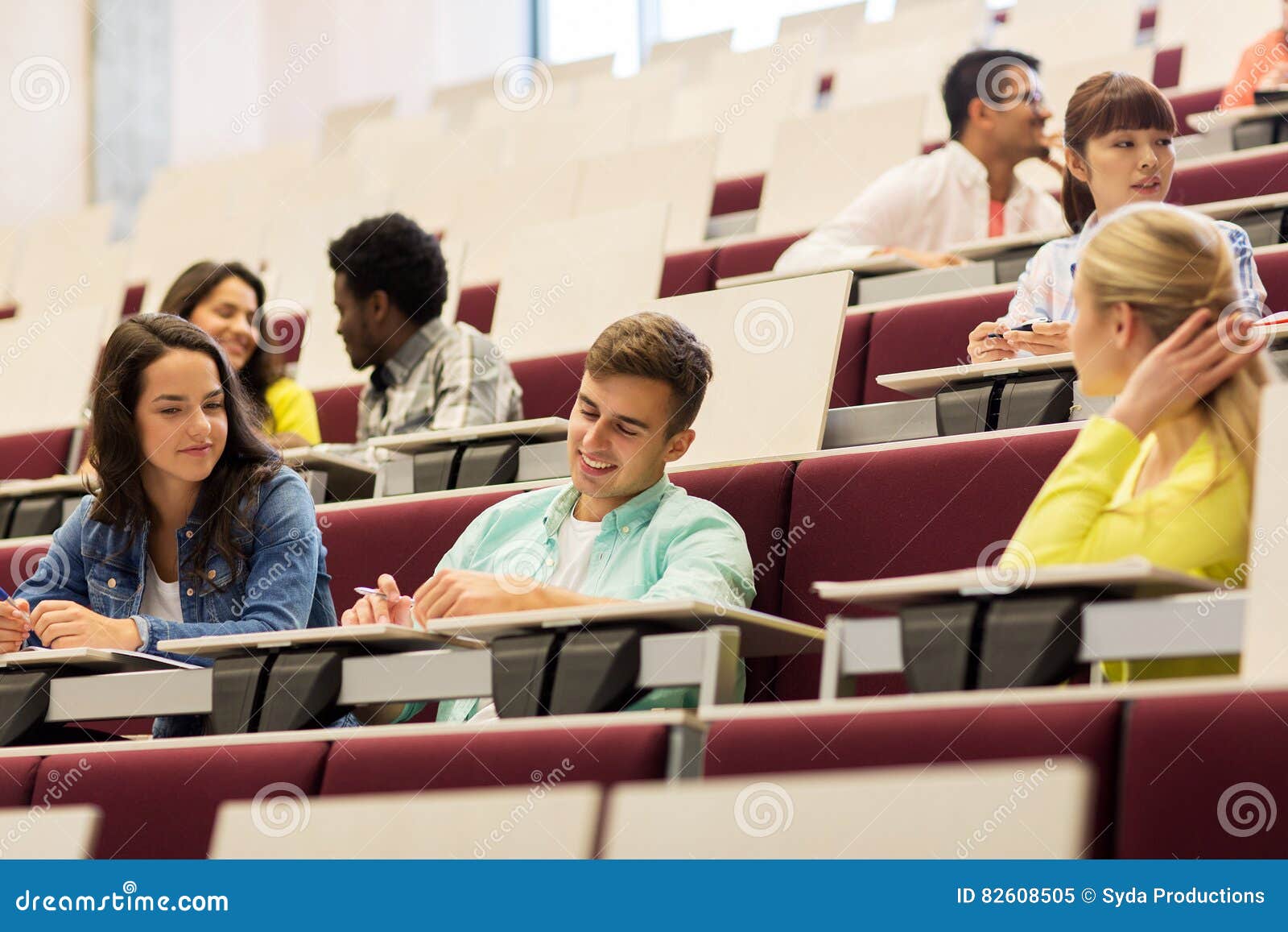 Group of Students with Notebooks in Lecture Hall Stock Image - Image of ...