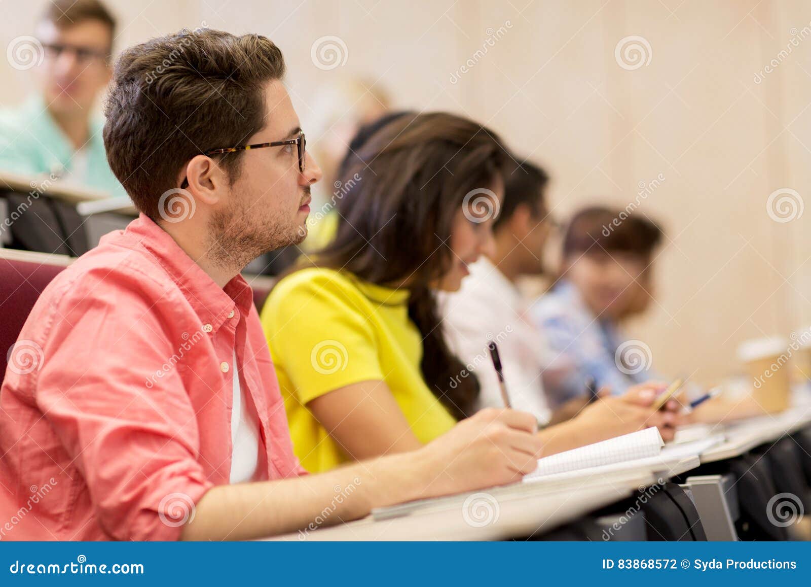 Group of Students with Notebooks in Lecture Hall Stock Photo - Image of ...