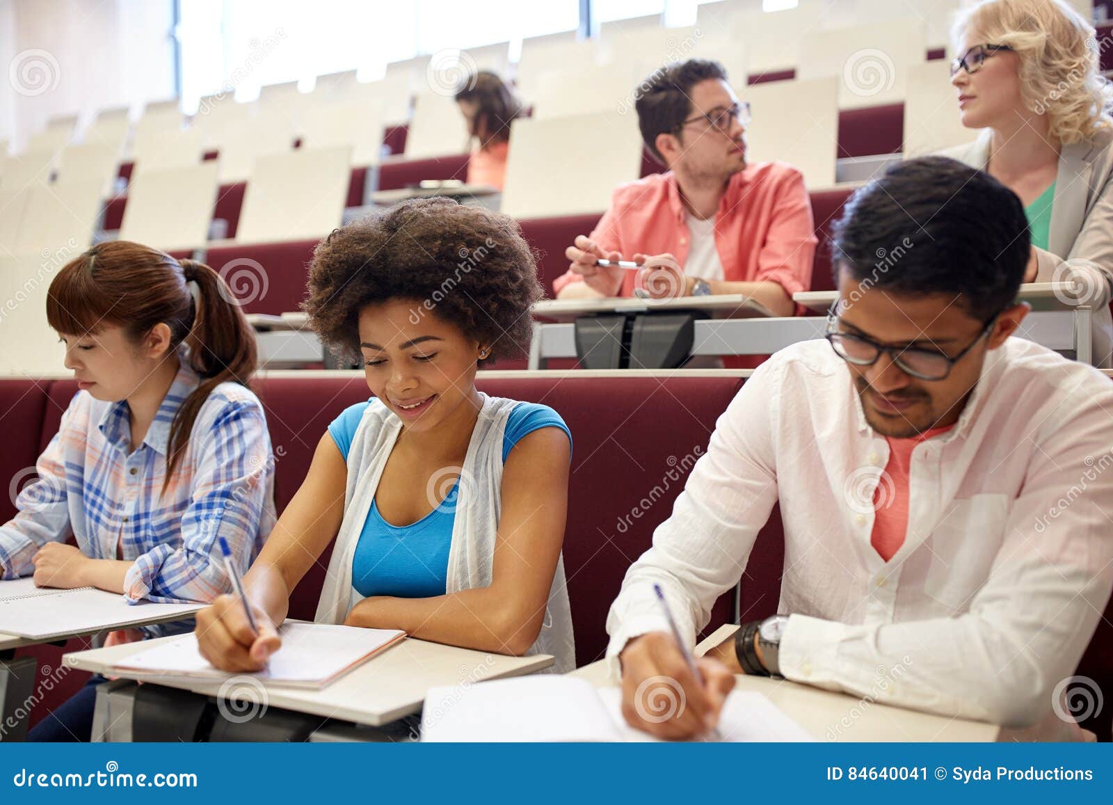 Group of Students with Notebooks in Lecture Hall Stock Image - Image of ...