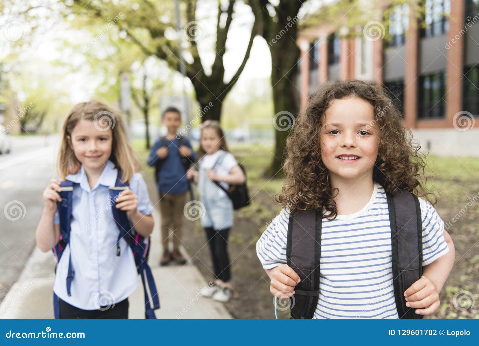 A Group of Students Outside at School Standing Together Stock Photo ...