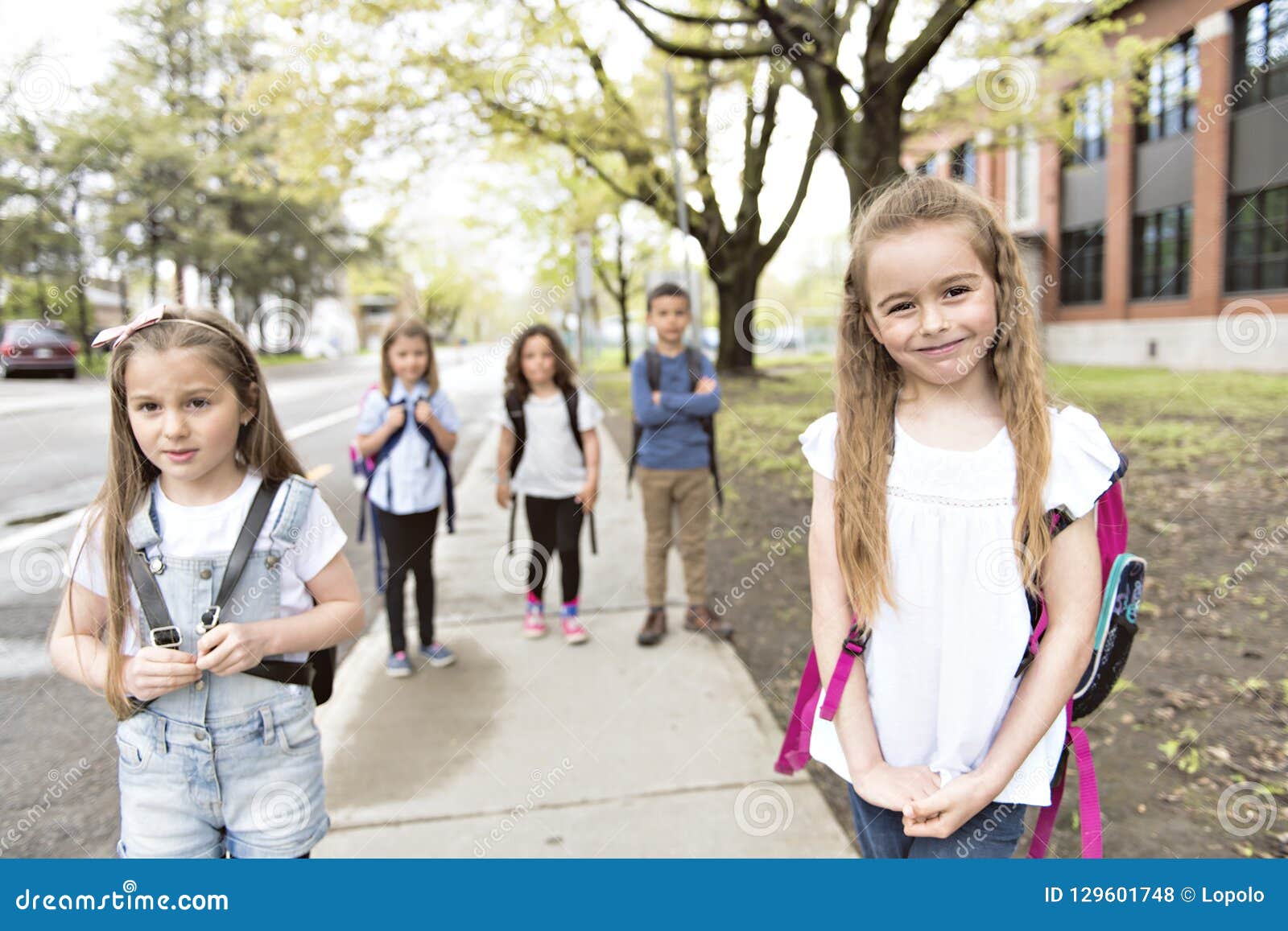 A Group of Students Outside at School Standing Together Stock Photo ...