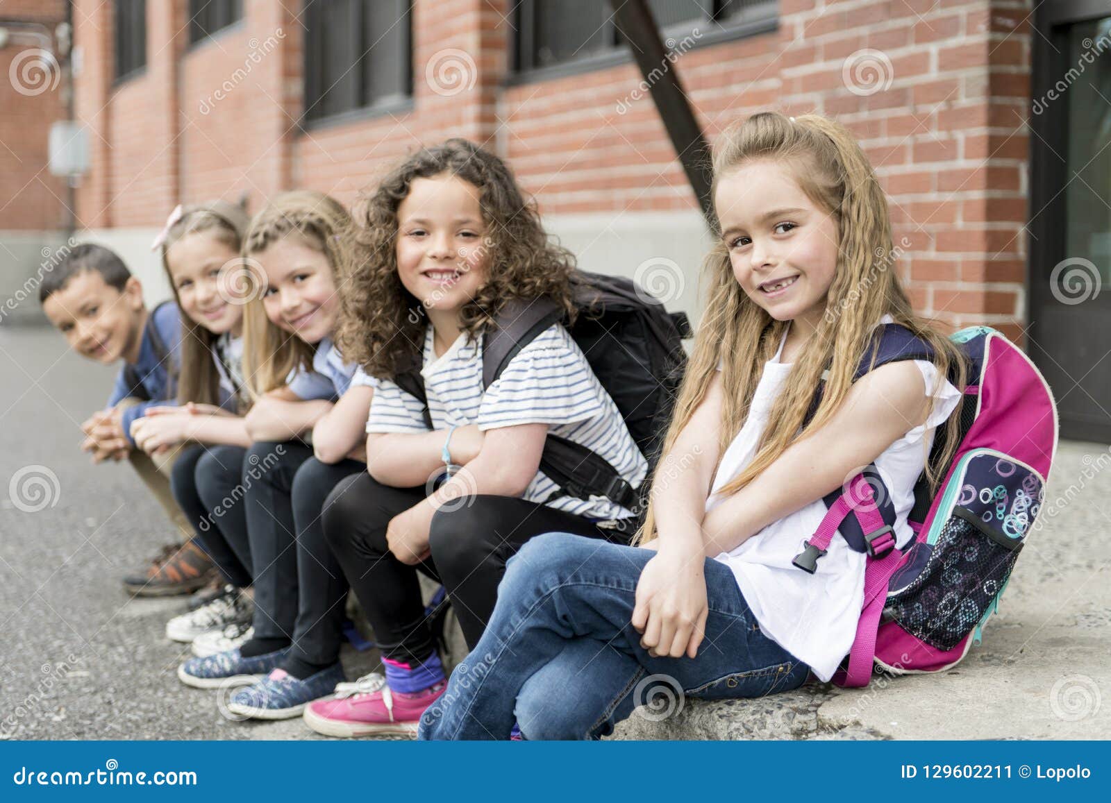 A Group of Students Outside at School Standing Together Stock Image ...