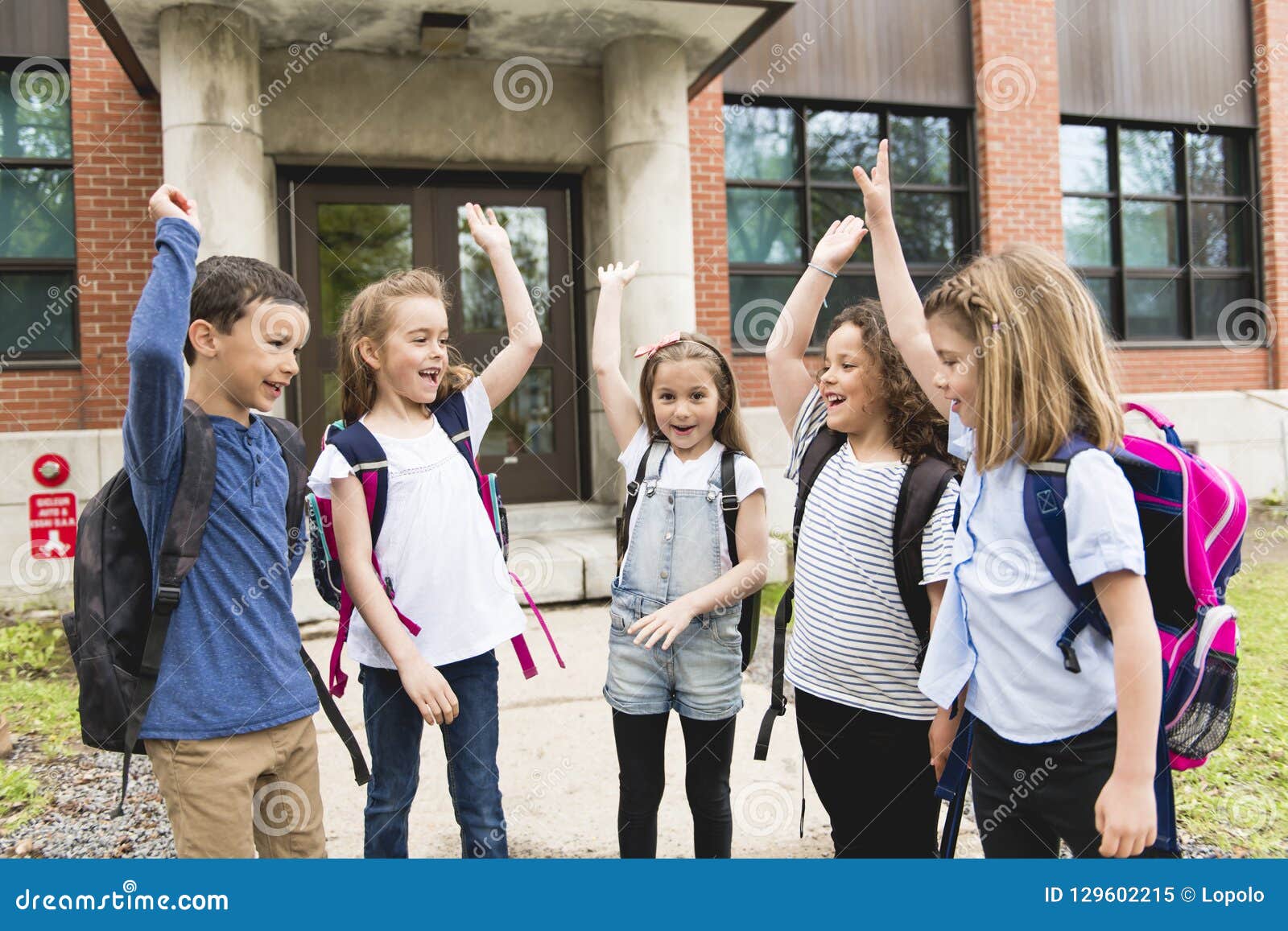 A Group of Students Outside at School Standing Together Stock Image ...