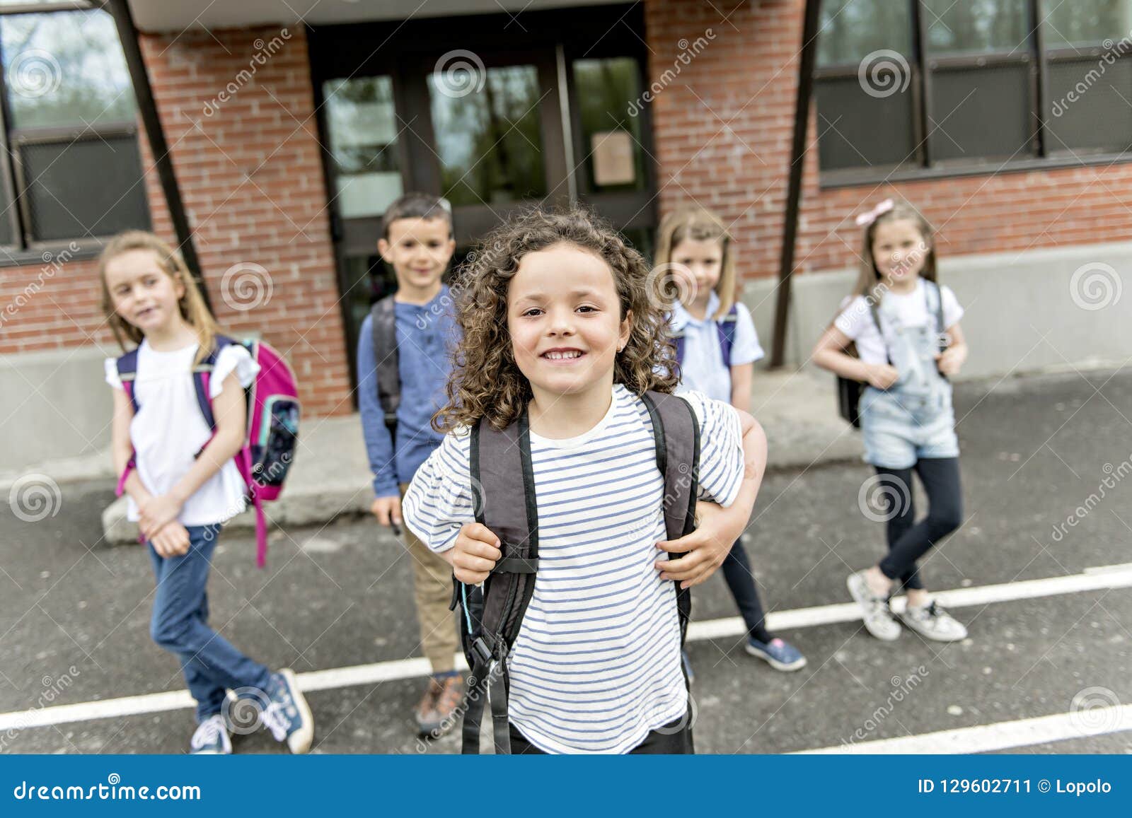 A Group of Students Outside at School Standing Together Stock Image ...