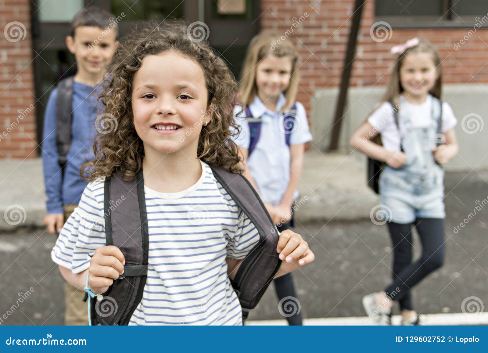 A Group of Students Outside at School Standing Together Stock Photo ...