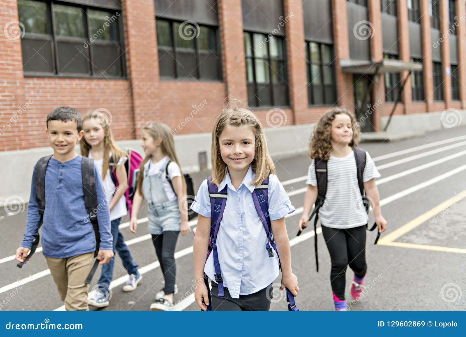 A Group of Students Outside at School Standing Together Stock Image ...
