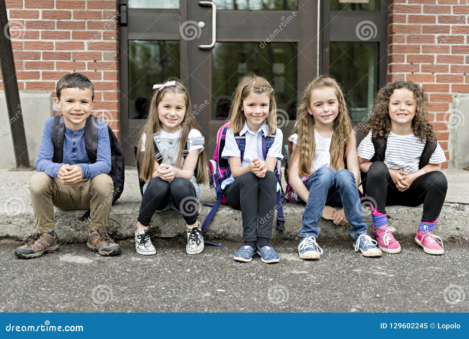A Group of Students Outside at School Standing Together Stock Image ...