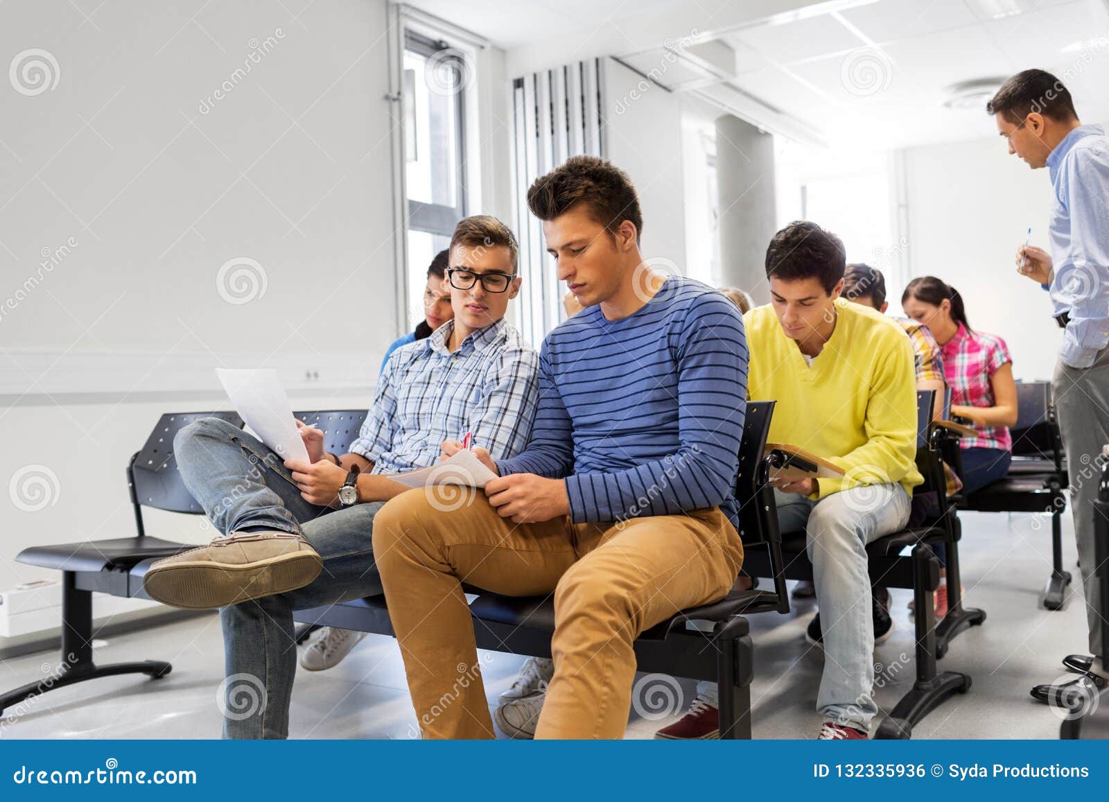 Group of Students with Papers in Lecture Hall Stock Photo - Image of ...