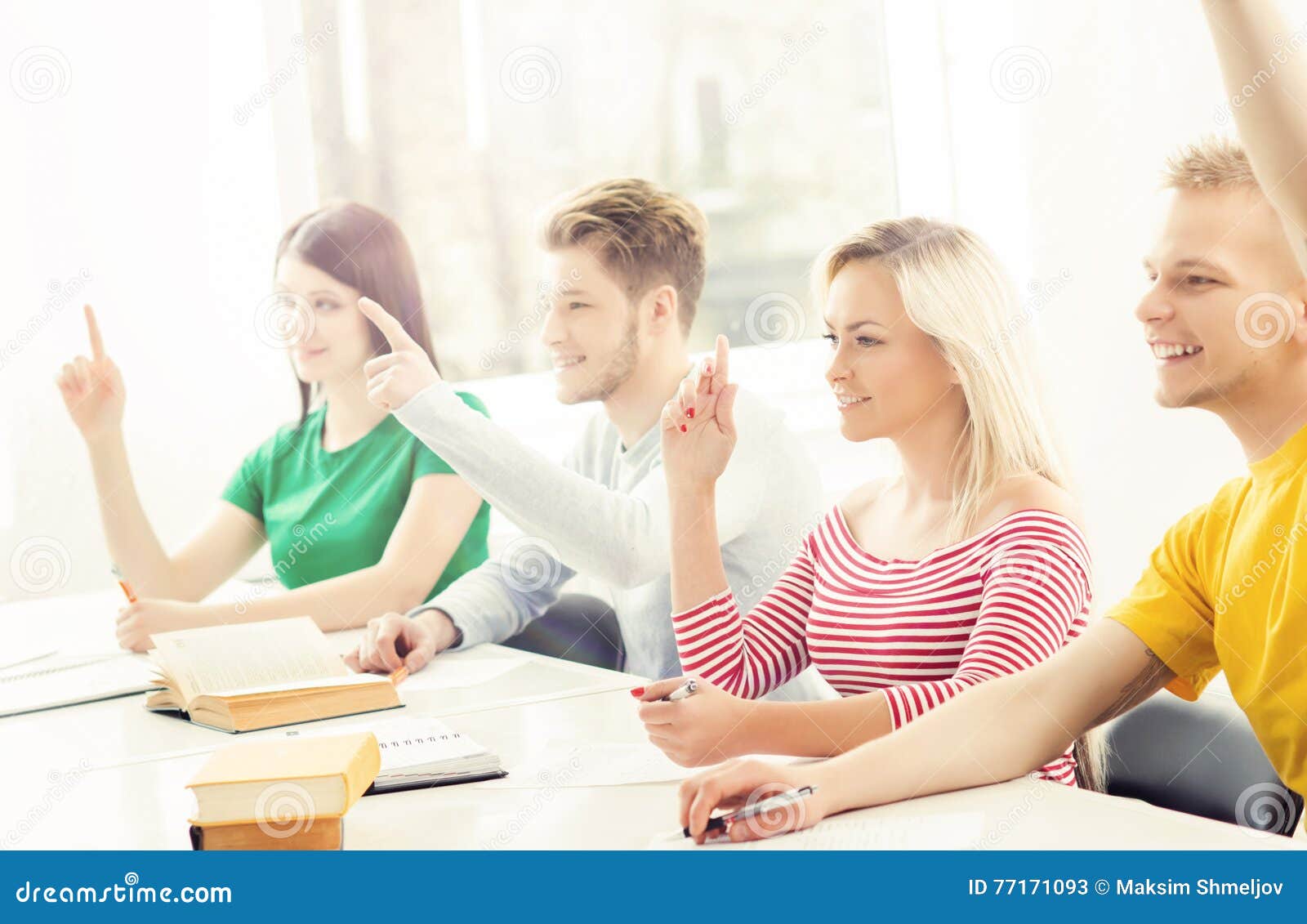 Group of Students Raising Hands. Teenagers in a Classroom. Stock Image ...