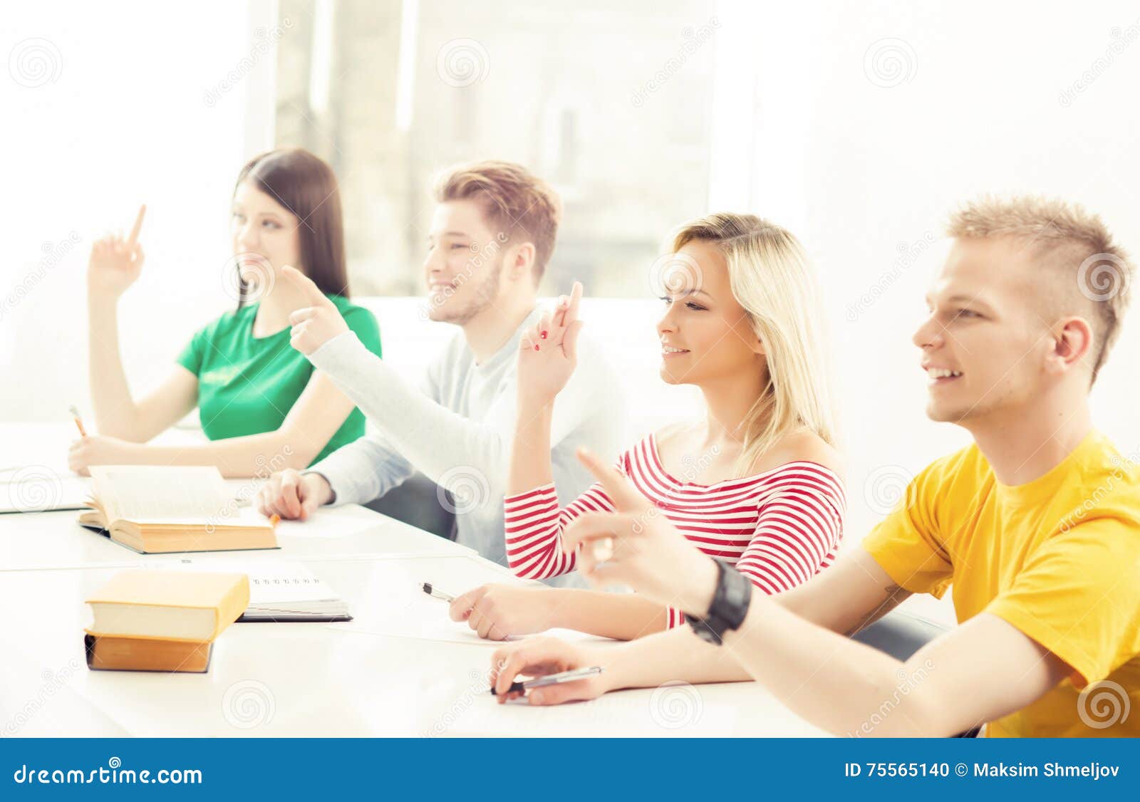 Group of Students Raising Hands. Teenagers Study in a Classroom Stock ...