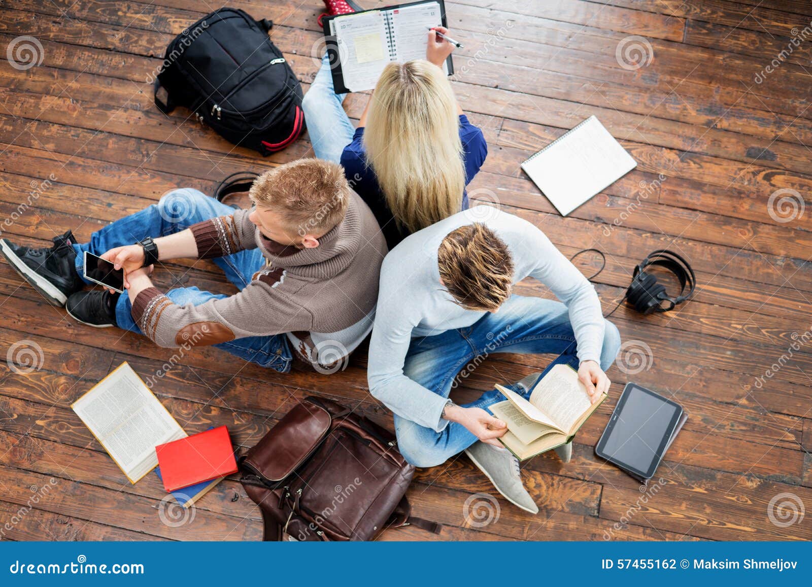 Group of Students Reading Books, Writing in Notebooks Stock Photo ...