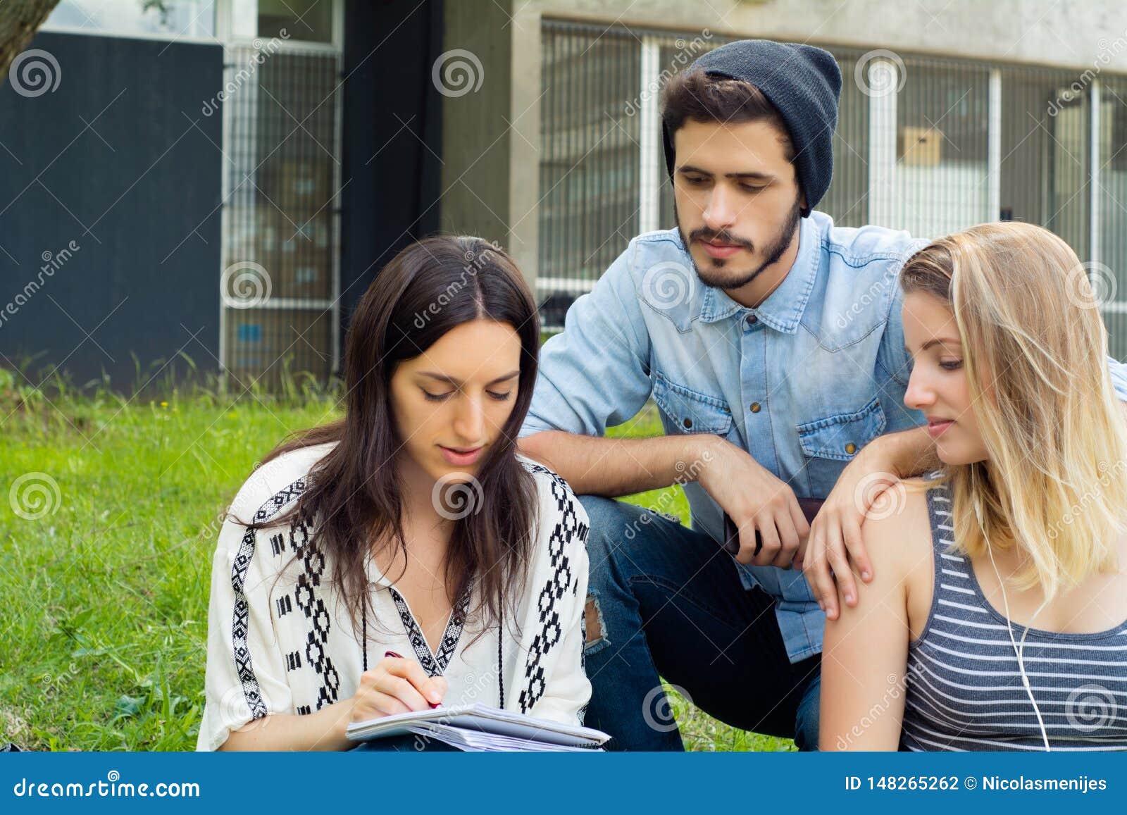 Group of Group of Students Relaxing in School Campus Stock Photo ...