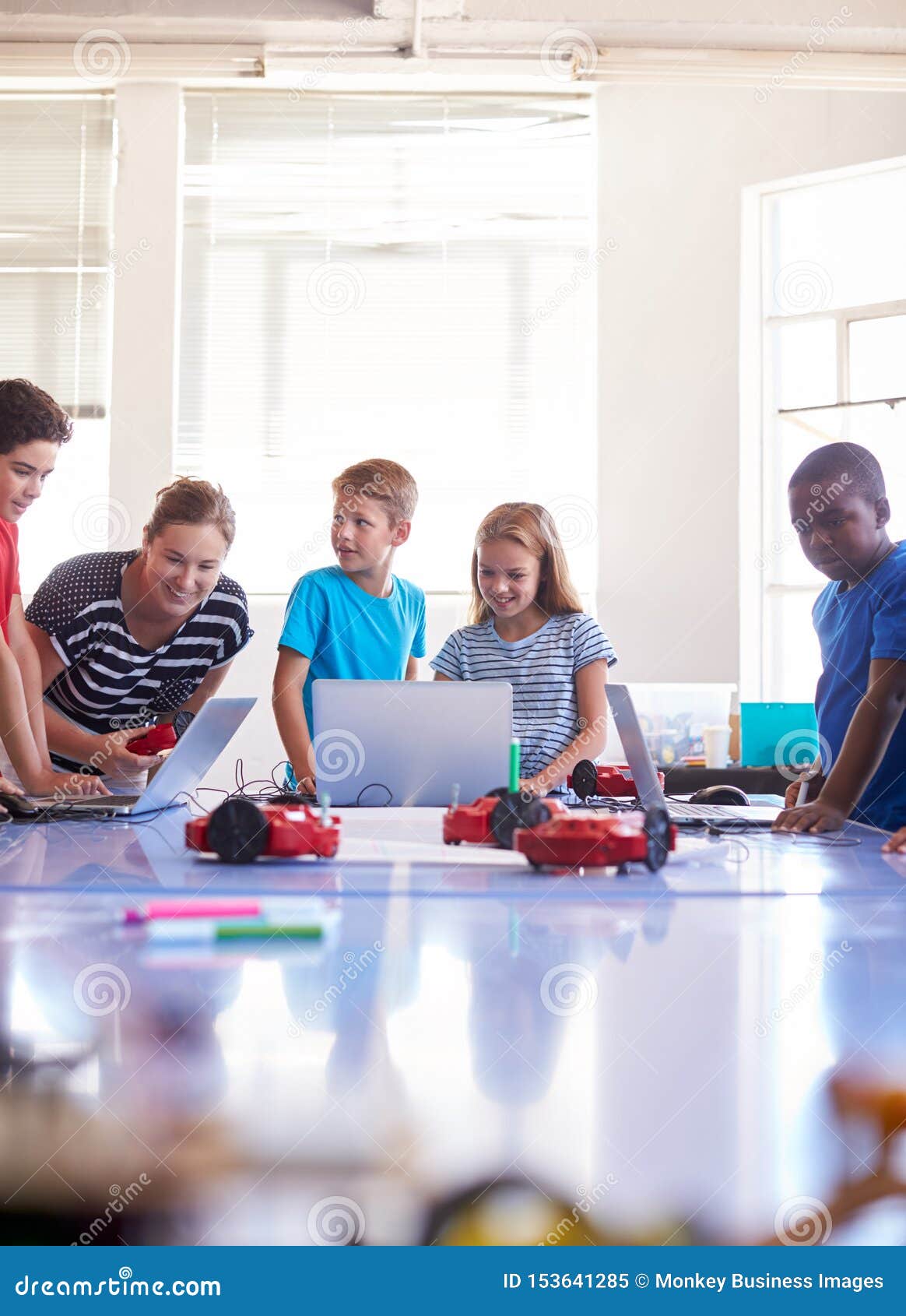 Group of Students in after School Computer Coding Class Learning To ...