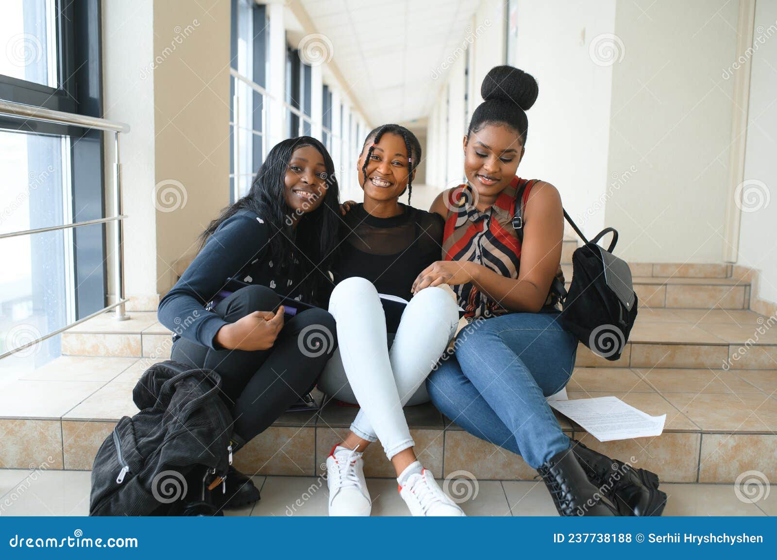 Group of Students Sitting on Steps Stock Photo - Image of friends ...