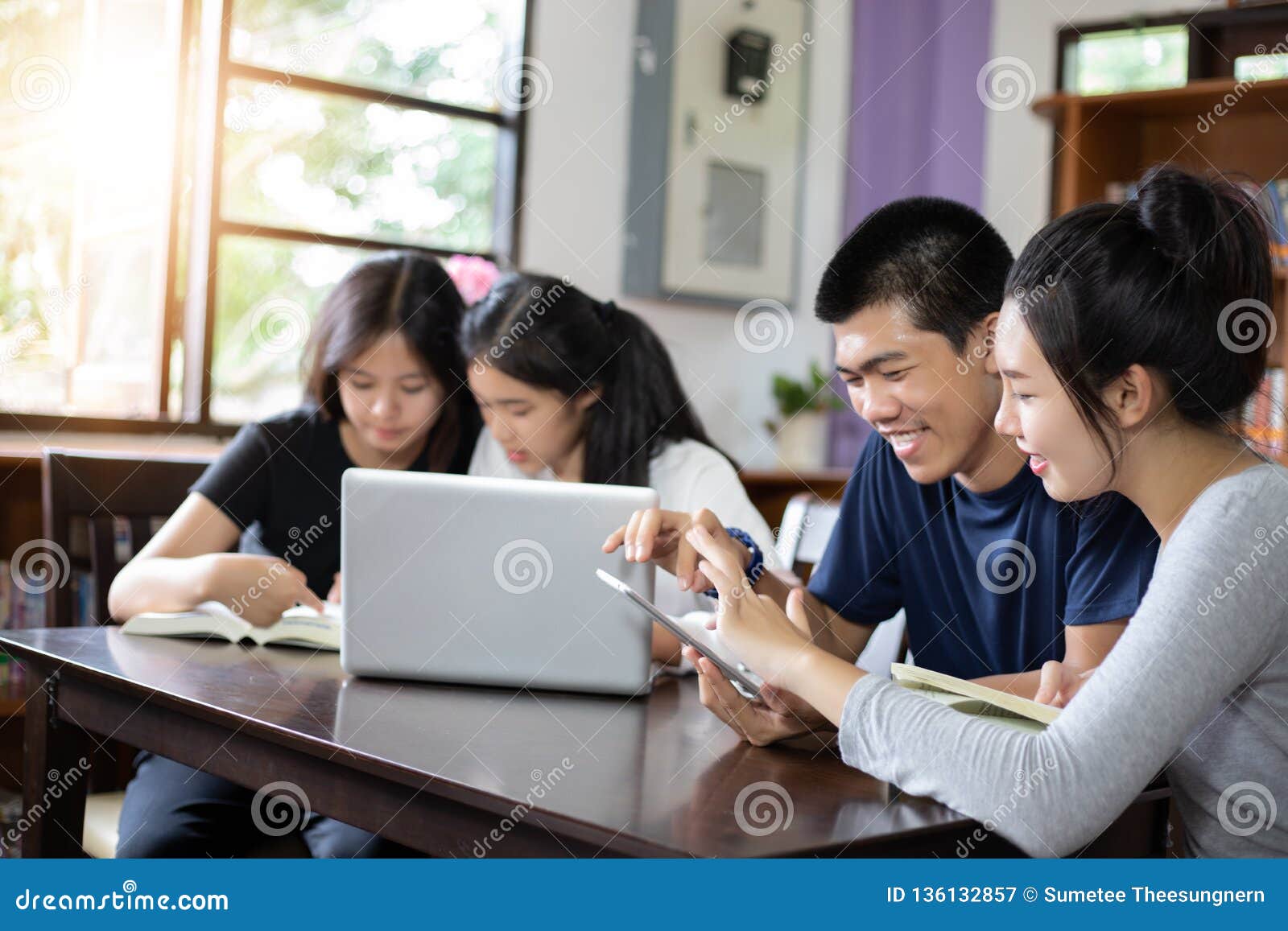 Group Students Smile and Have Fun and Using Tablet it Also Helps To ...