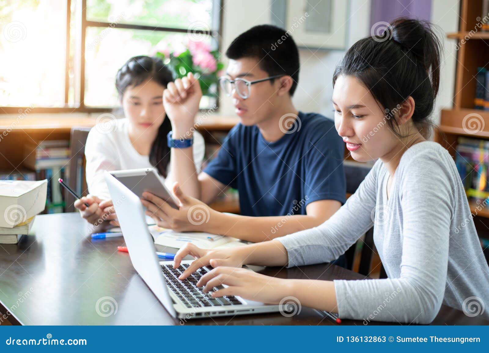 Group Students Smile and Have Fun and Using Tablet it Also Helps To ...