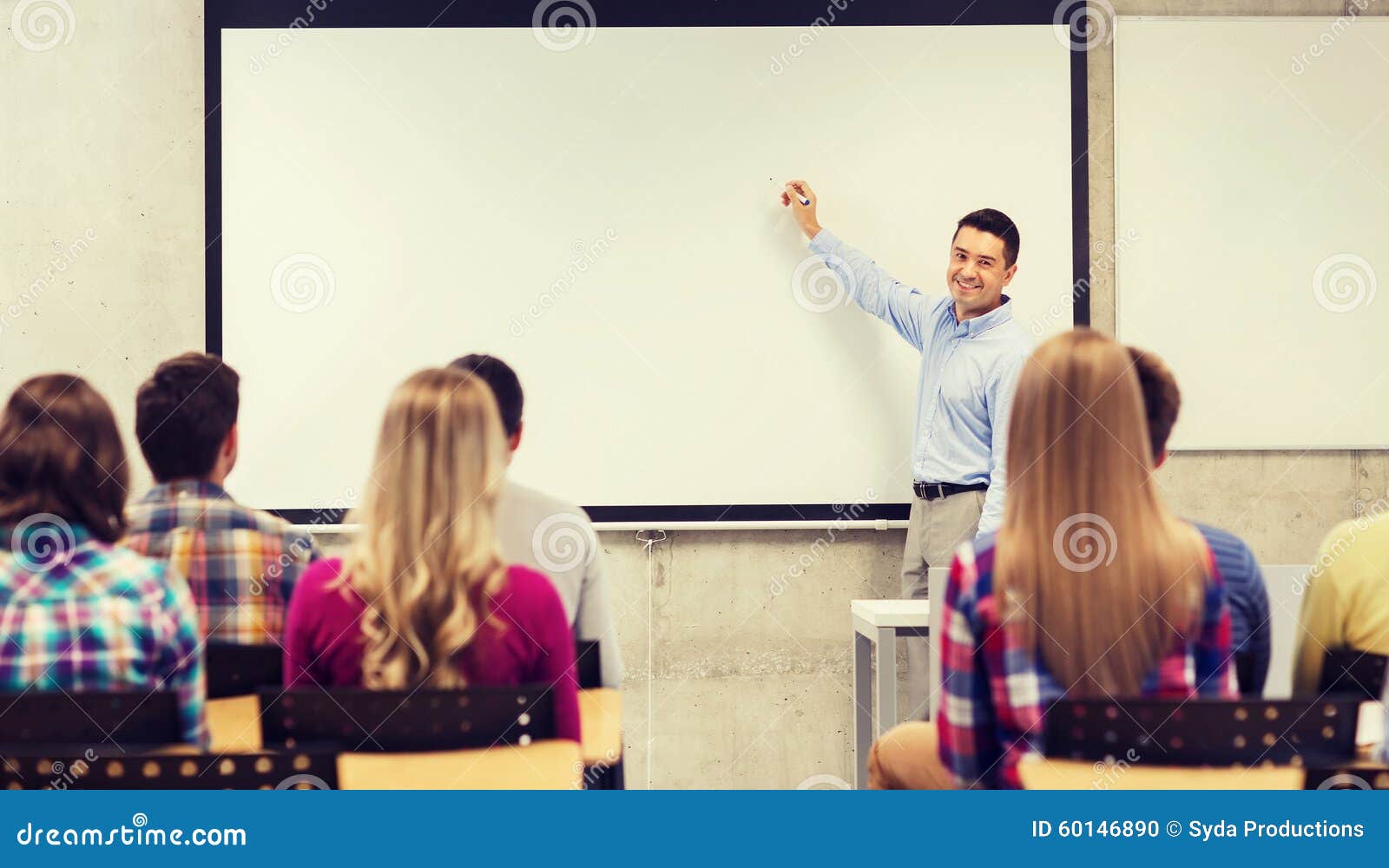 Group of Students and Smiling Teacher in Classroom Stock Photo - Image ...