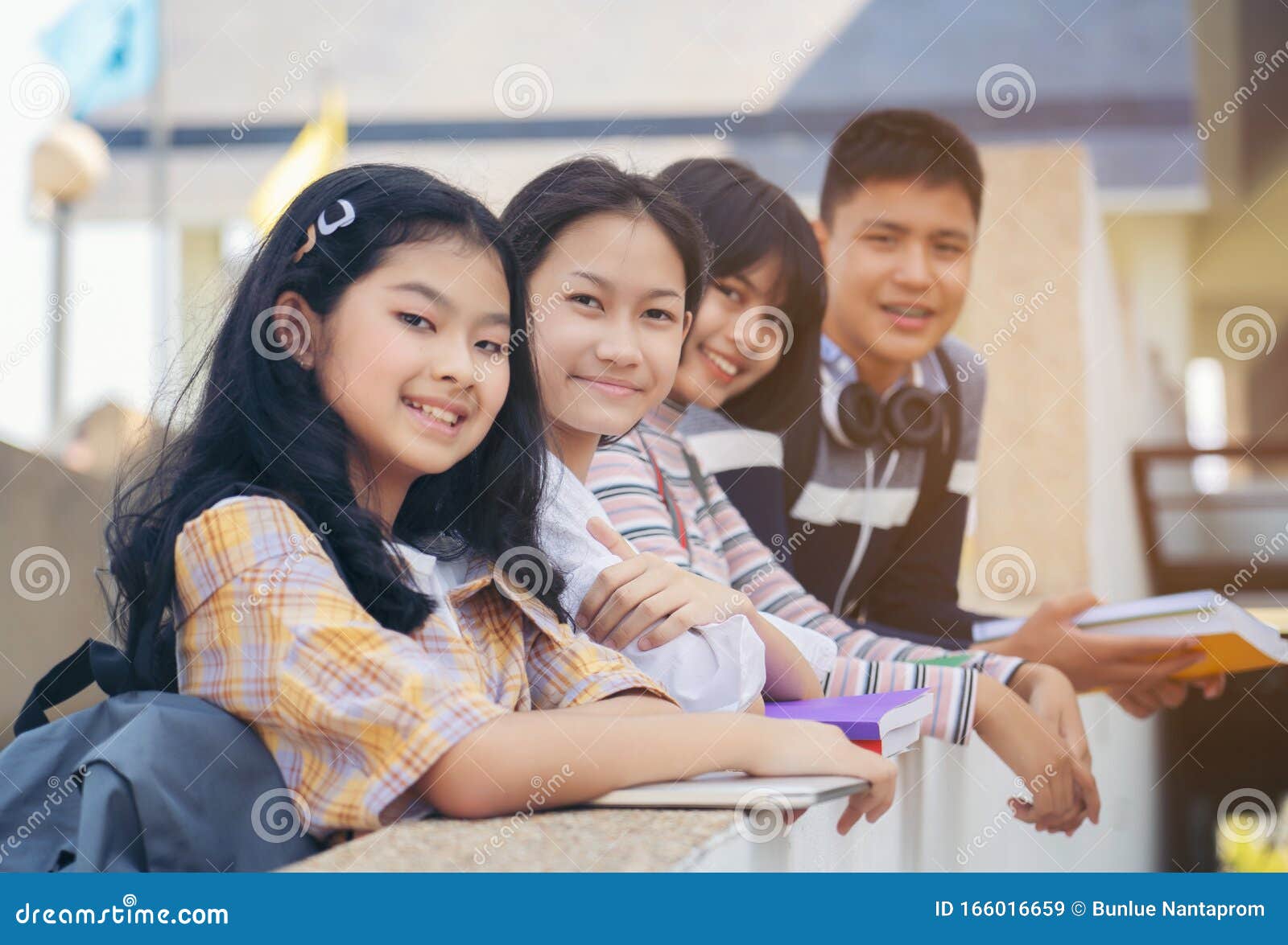 Group of Students Standing Together Over Wall Walkway Stock Image ...