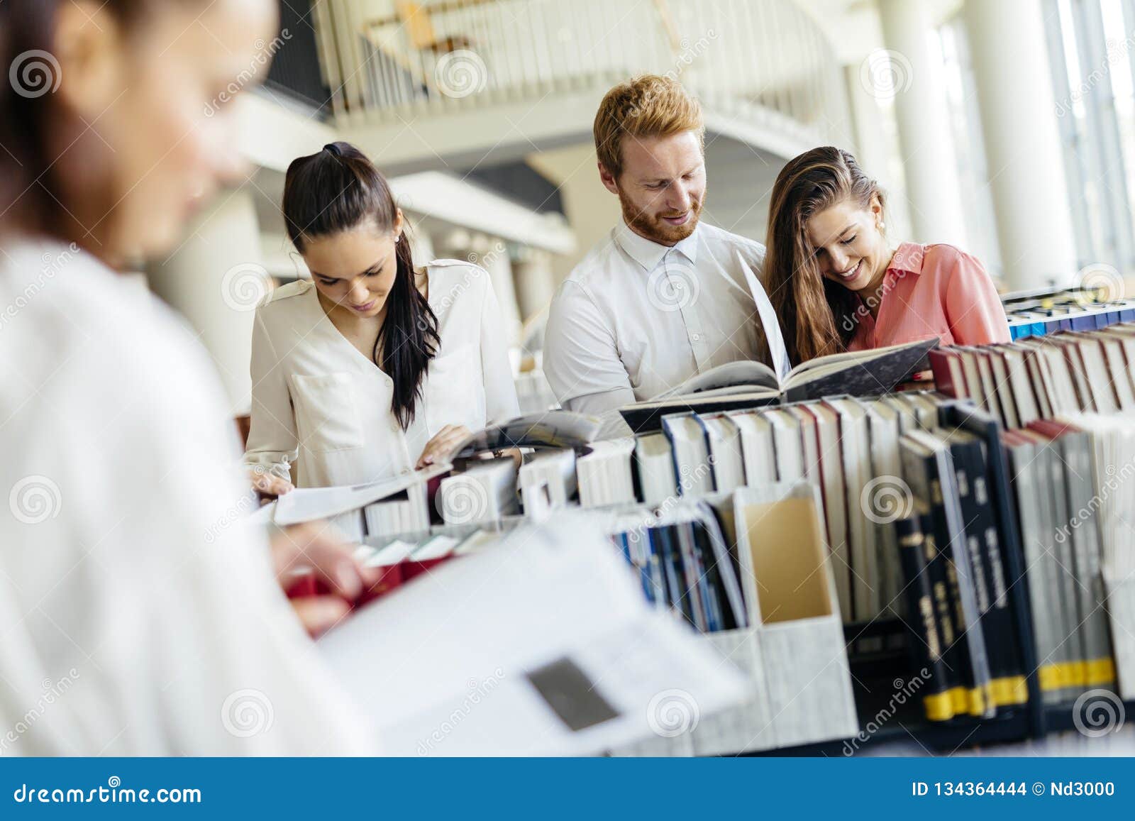 Group of Students Studying in Library Stock Photo - Image of reading ...