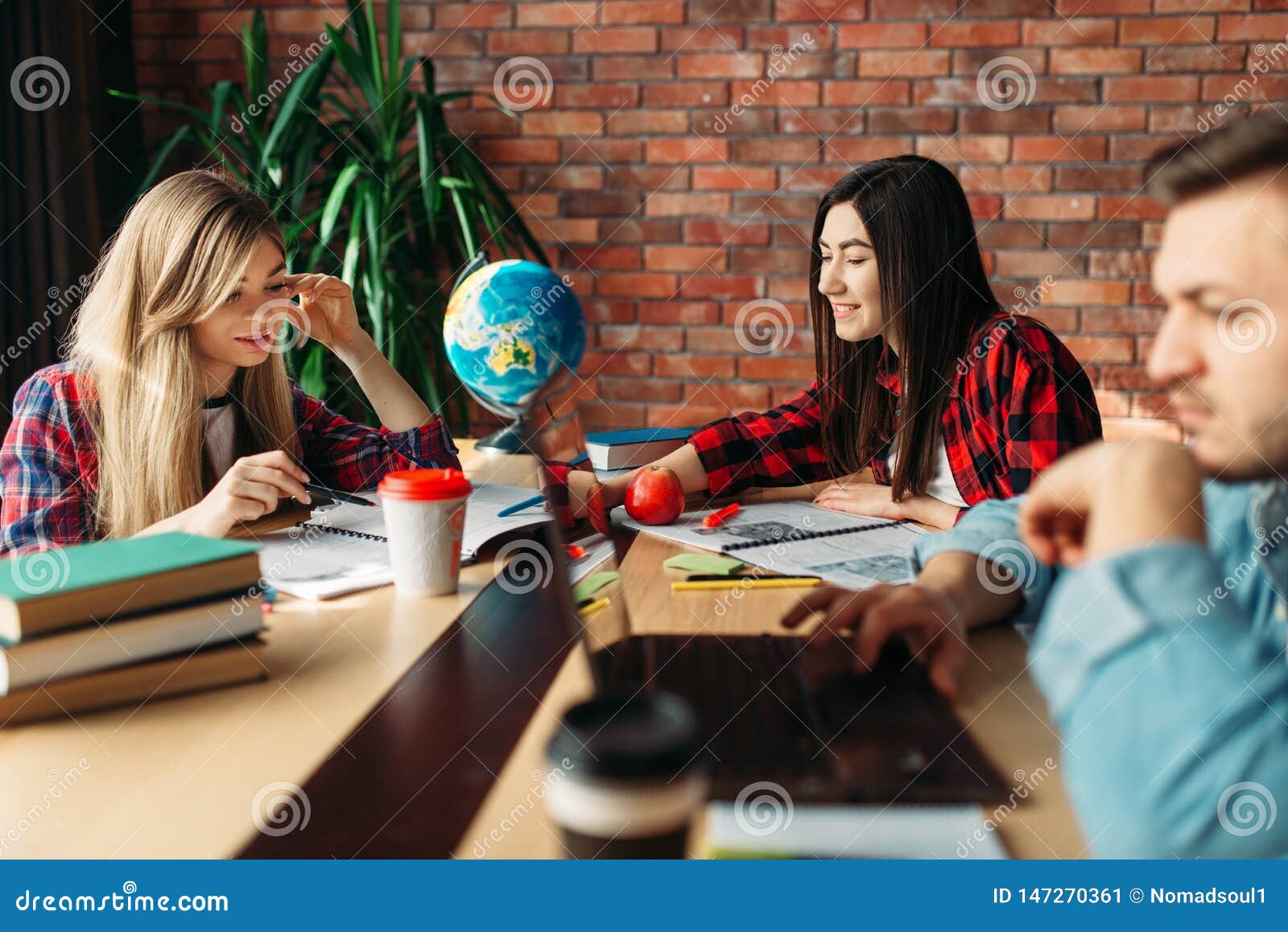 Group of Students Studying at the Table Together Stock Image - Image of ...