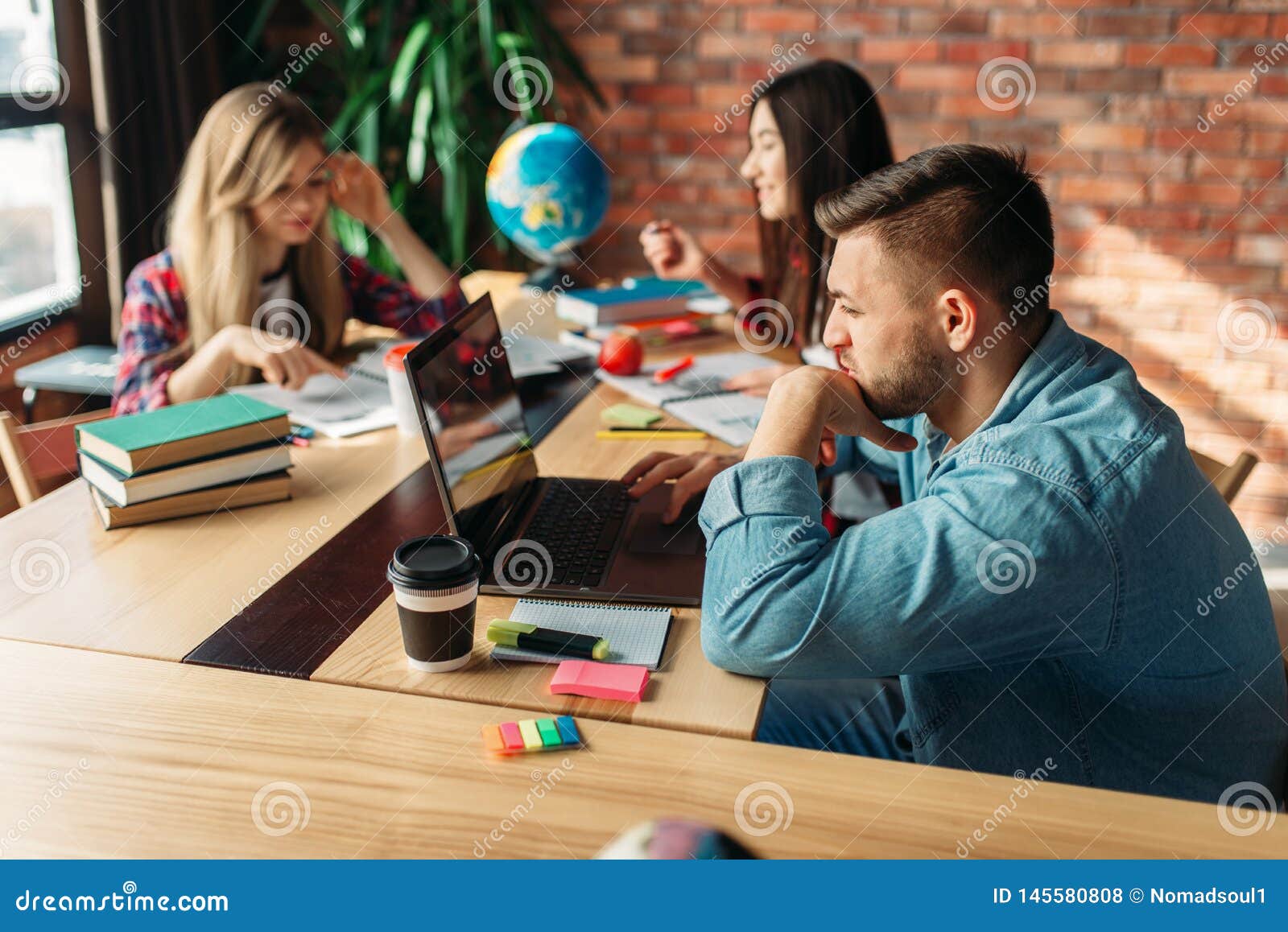 Group of Students Studying at the Table Together Stock Photo - Image of ...