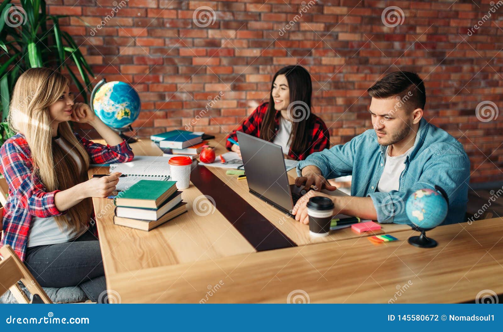 Group of Students Studying at the Table Together Stock Photo - Image of ...