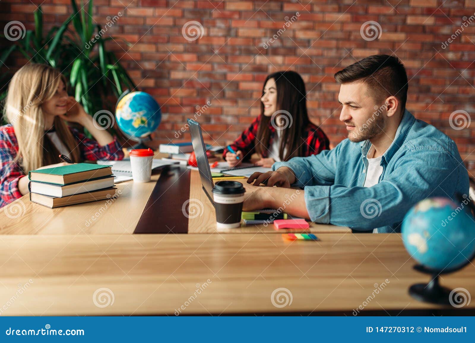 Group of Students Studying at the Table Together Stock Photo - Image of ...