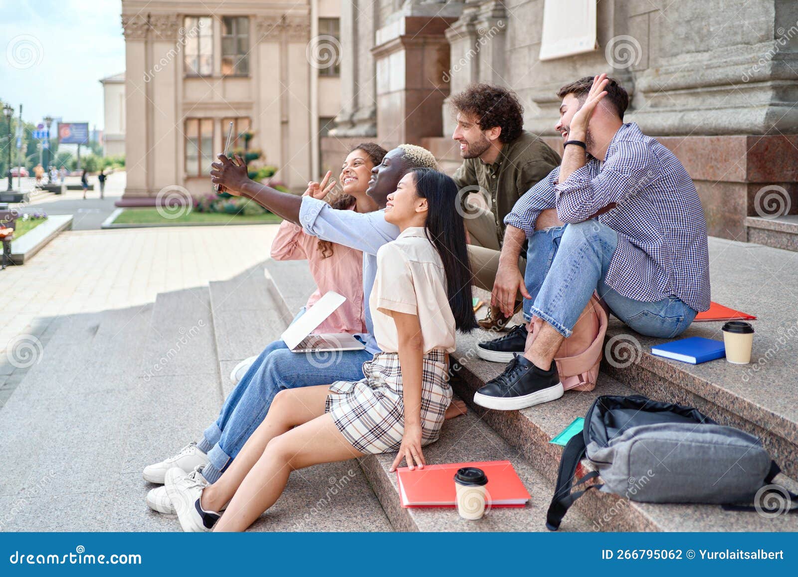 Group of Students Talking on a Video Link Sitting on the Steps. Stock ...