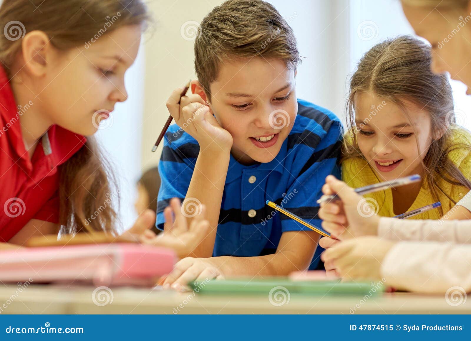 Group Of Students Talking And Writing At School Stock Photo - Image ...