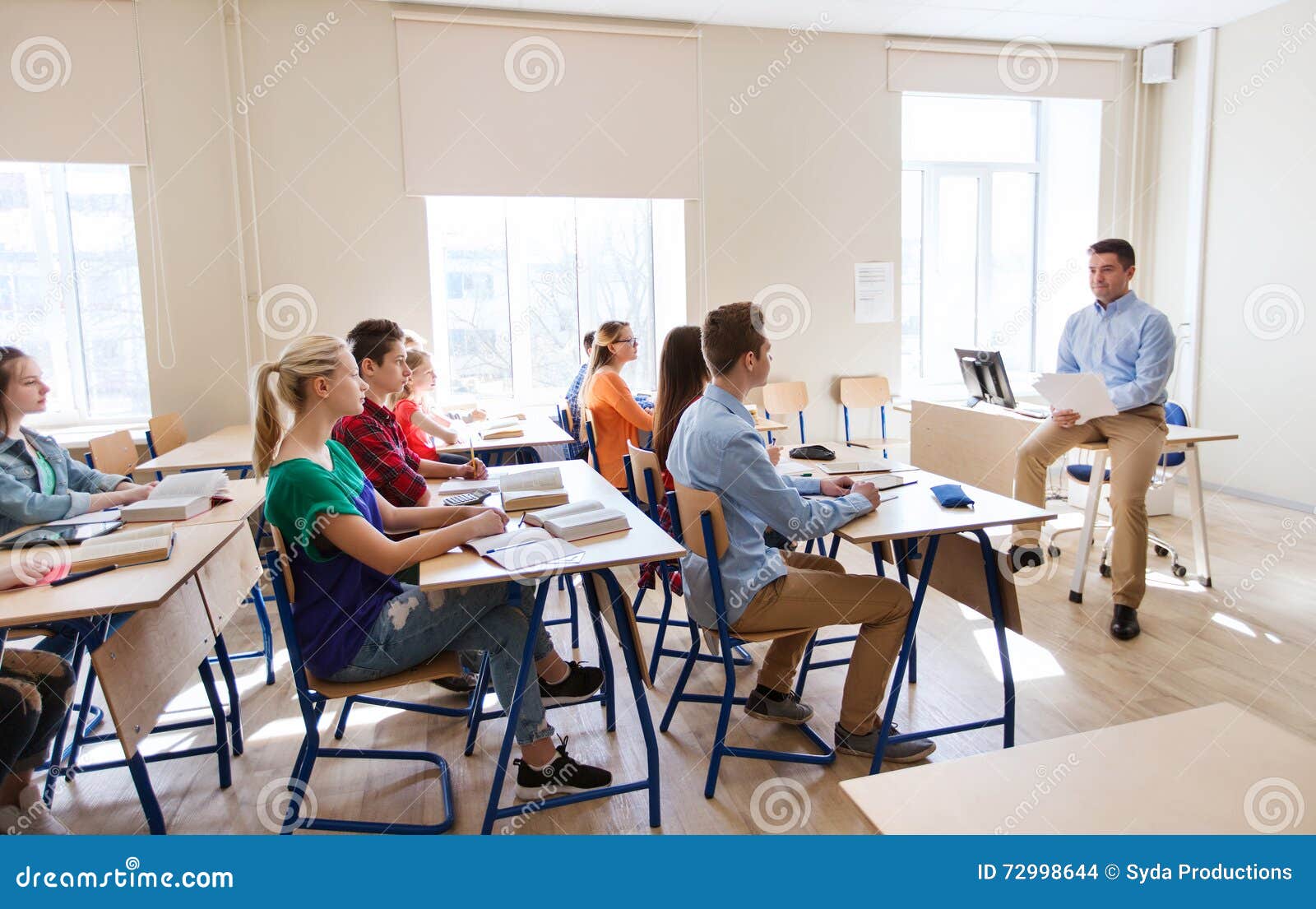 Group of Students and Teacher with Papers or Tests Stock Photo - Image ...