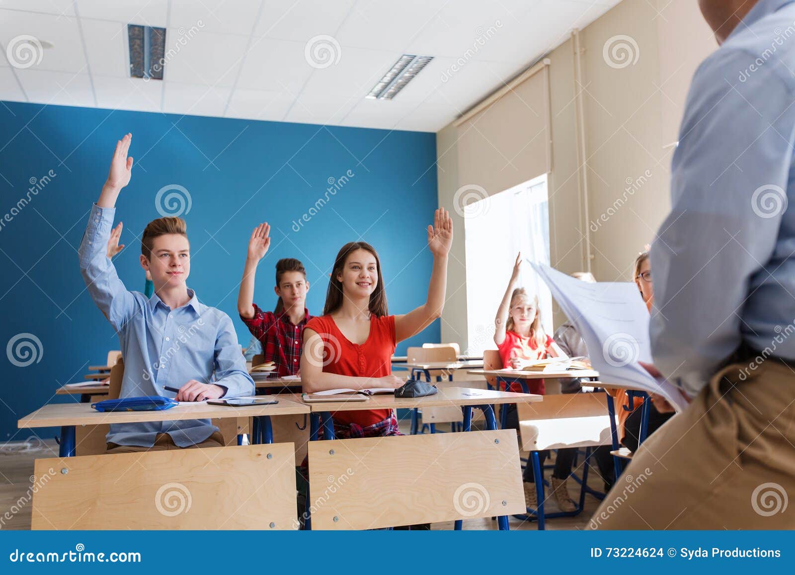 Group of Students and Teacher with Papers or Tests Stock Photo - Image ...