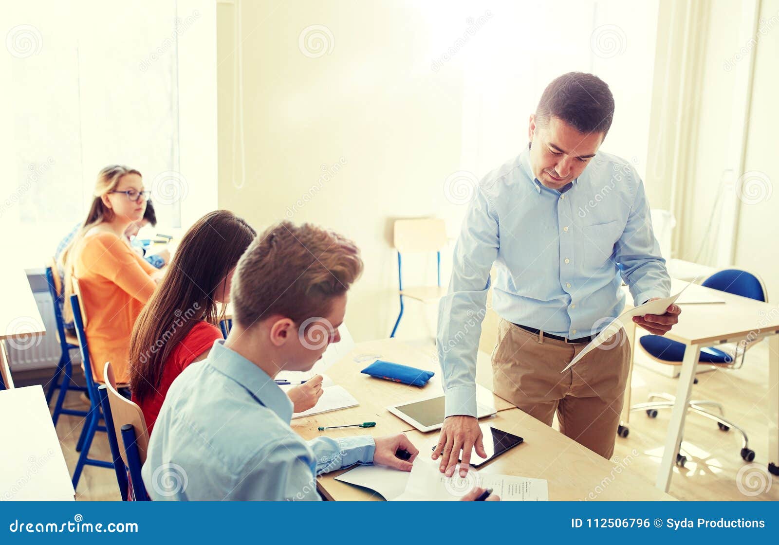 Group of Students and Teacher with Test Results Stock Photo - Image of ...