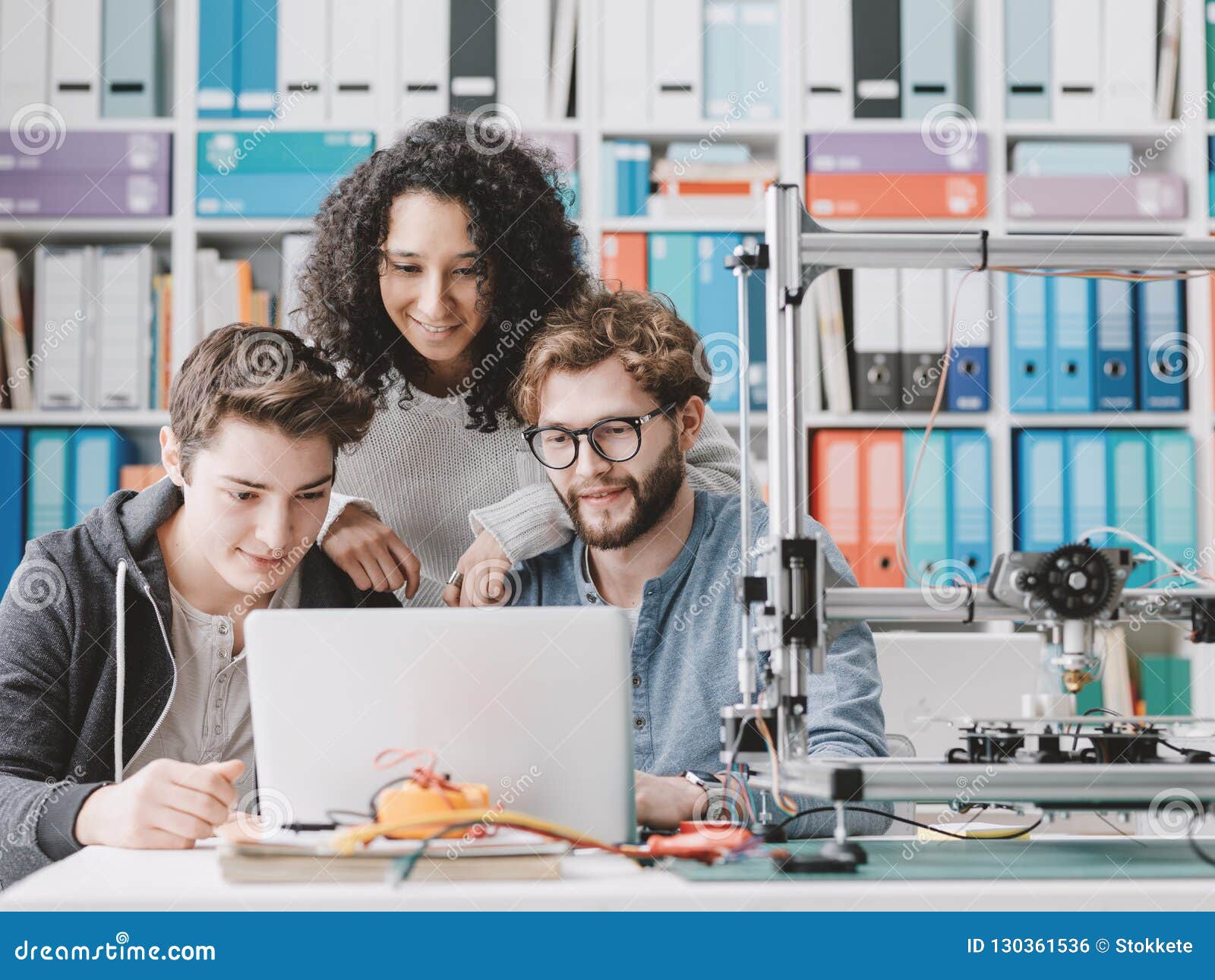 Group of Students Using a 3D Printer and a Laptop Stock Photo - Image ...