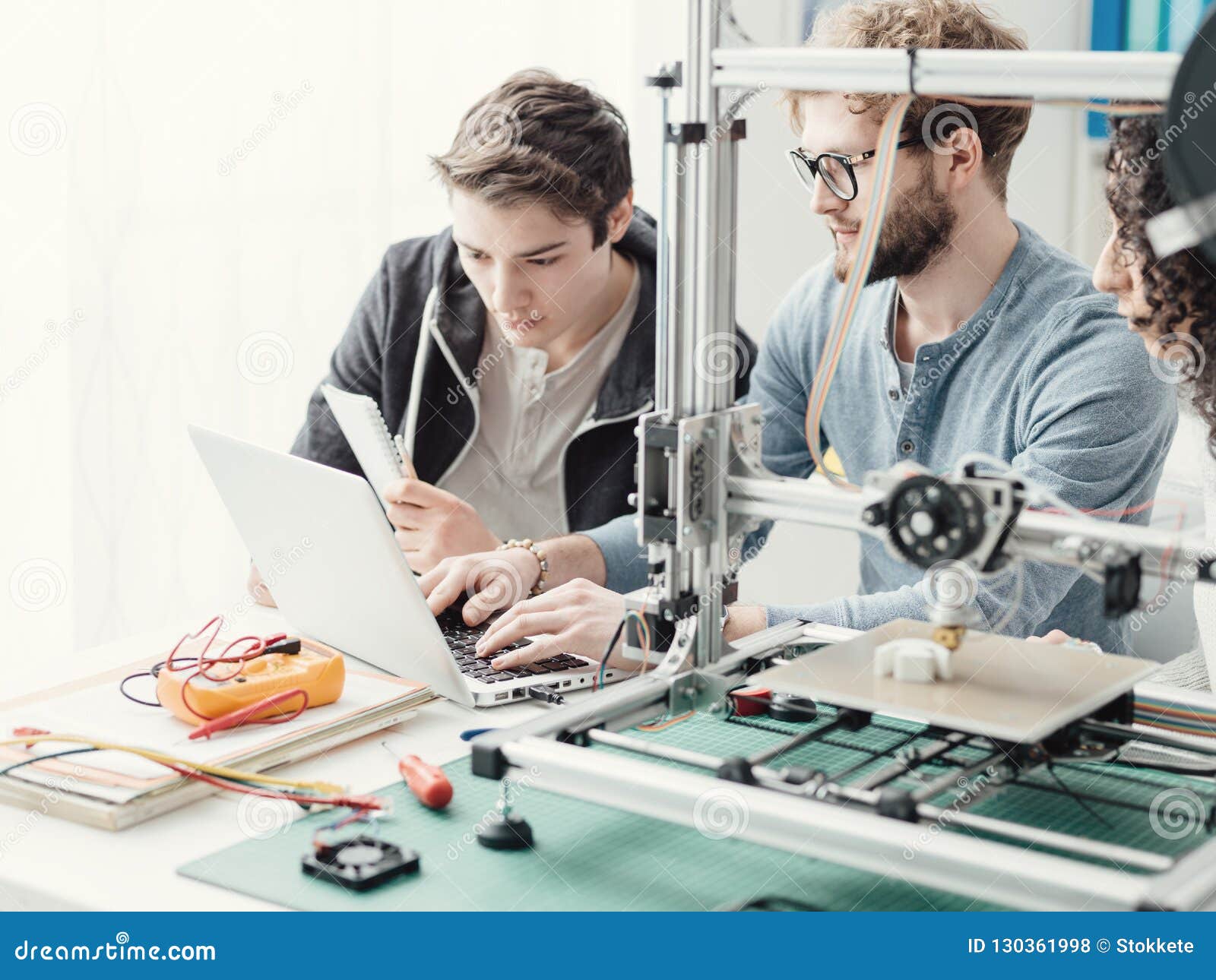 Group of Students Using a 3D Printer and a Laptop Stock Photo - Image ...
