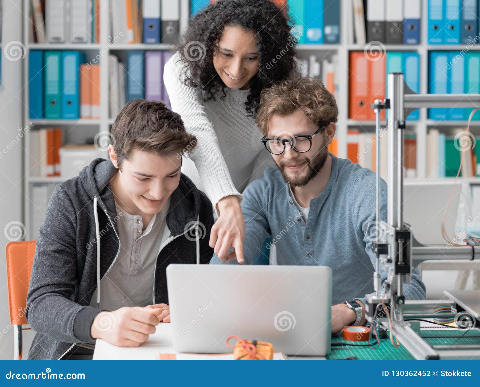 Group of Students Using a 3D Printer and a Laptop Stock Photo - Image ...