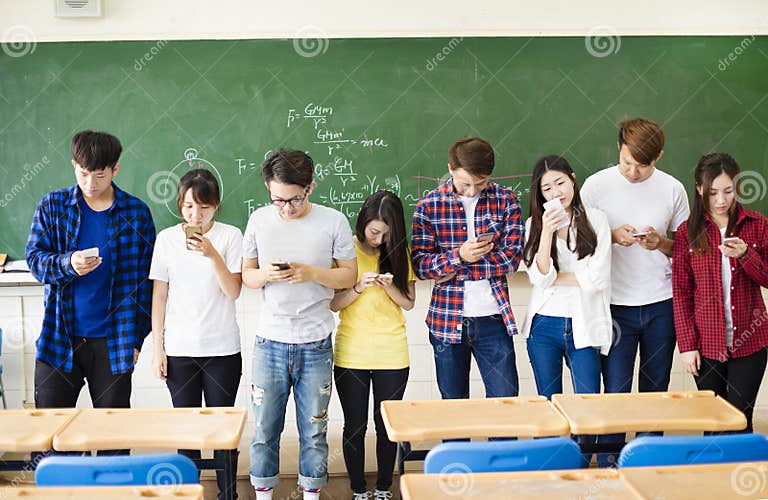 Group of Students Using Smart Mobile Phones in Classroom Stock Photo ...