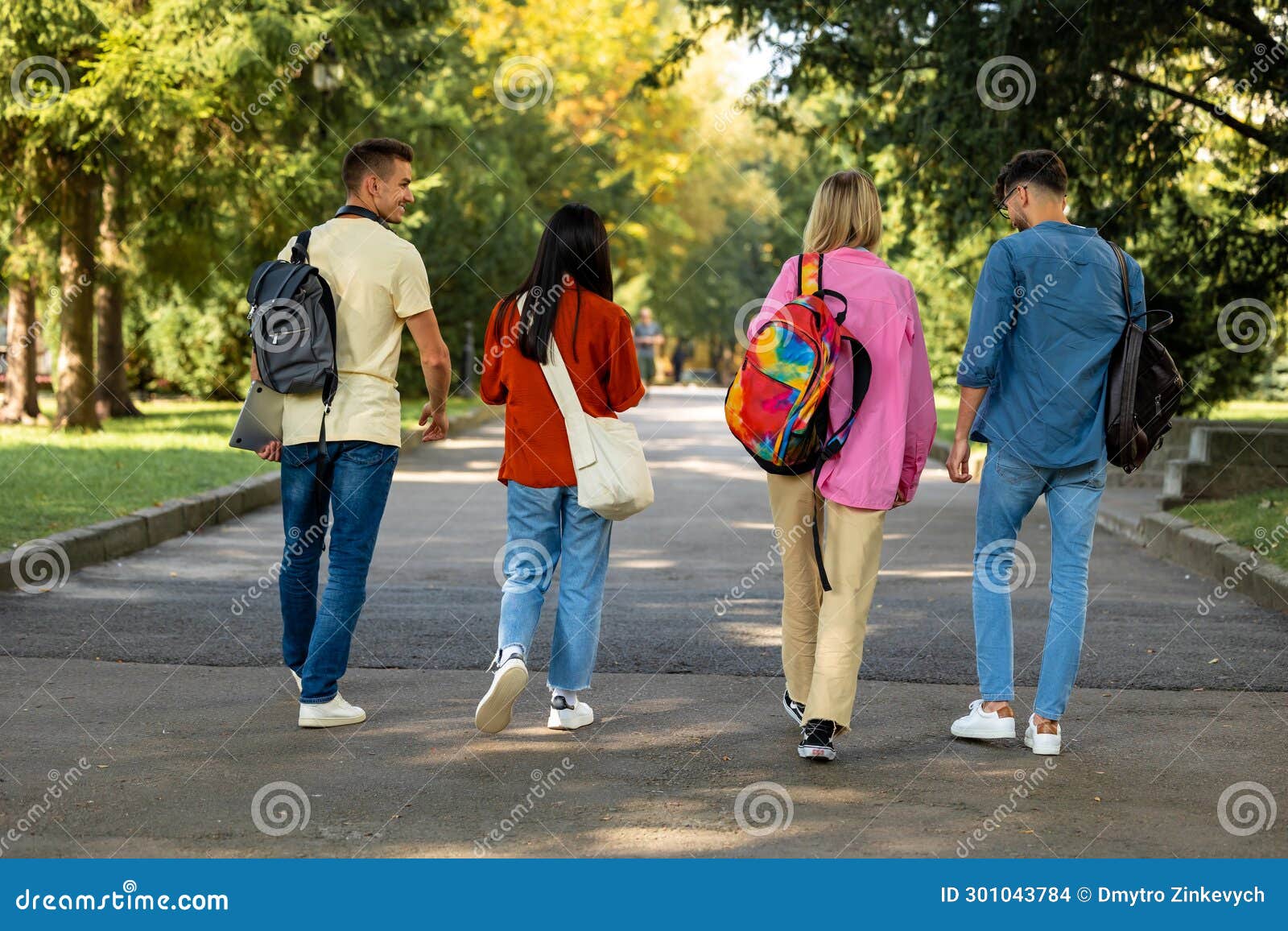 Group of Students Walking in the Park and Looking Excited Stock Photo ...