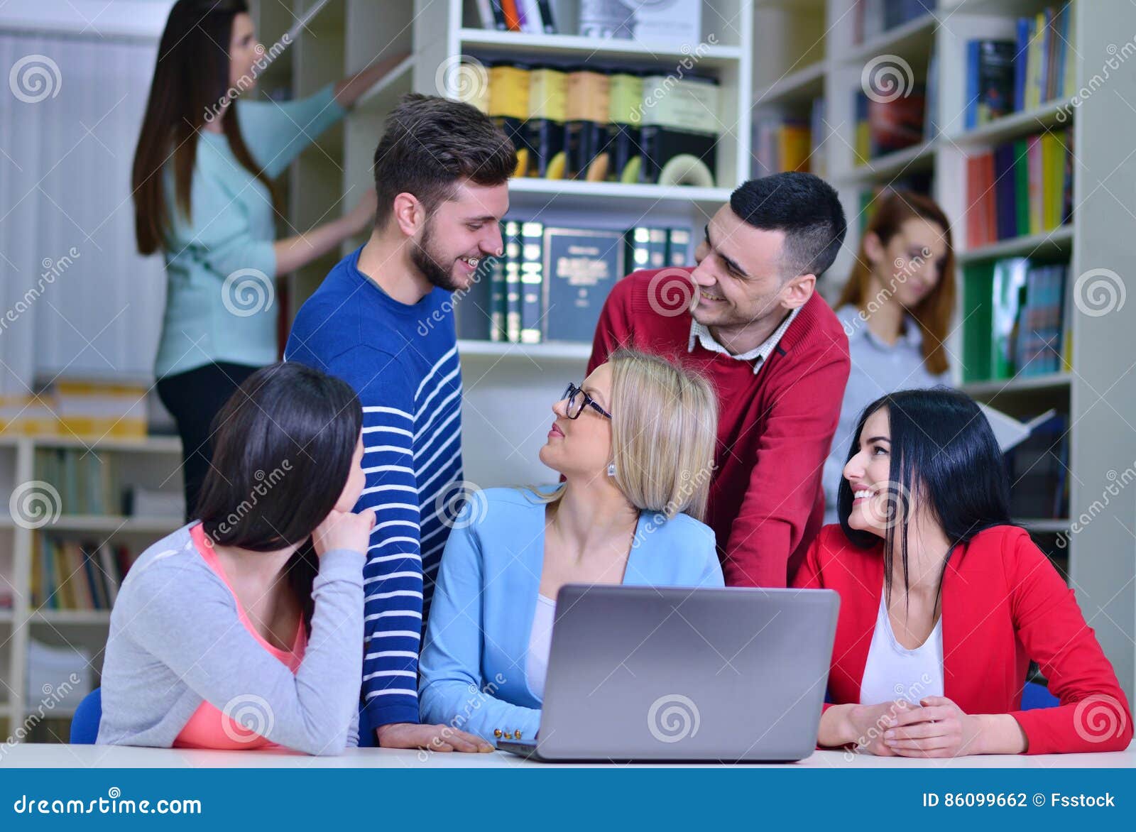 Group of Students Working Together in Library with Teacher Stock Photo ...