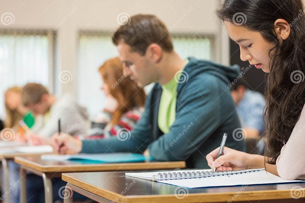 Group of Students Writing Notes in Classroom Stock Image - Image of ...