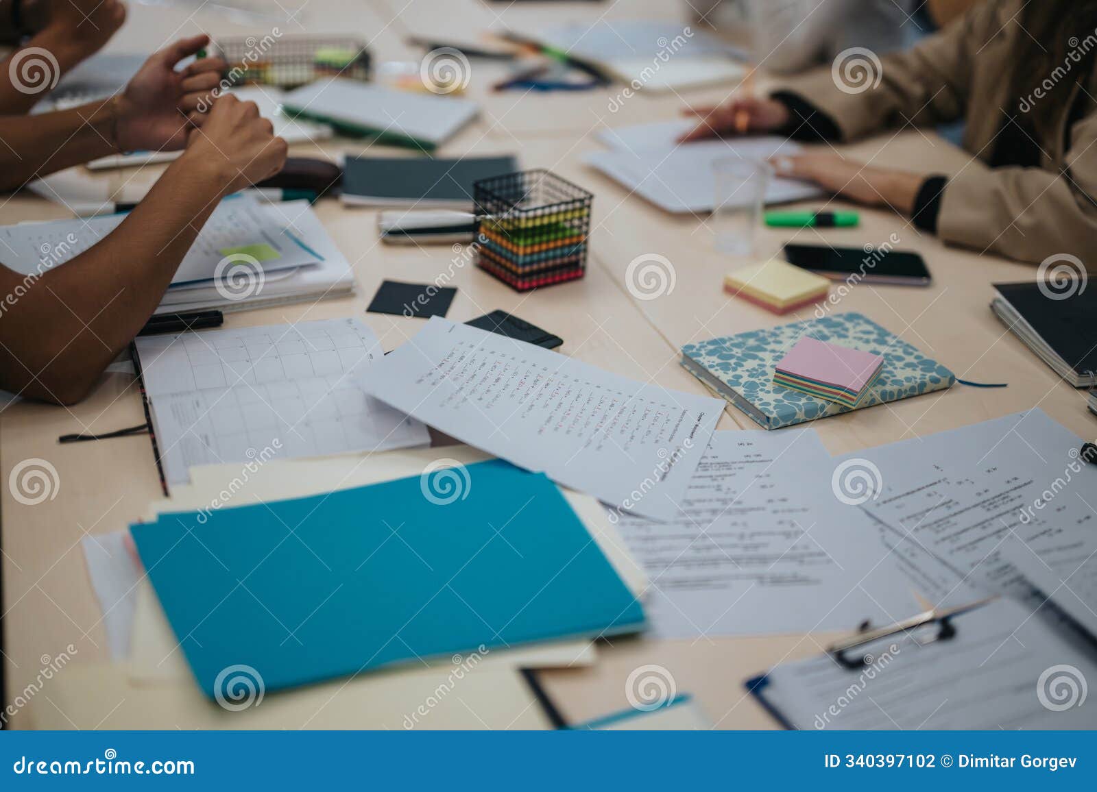 Group Study Session in a Classroom with Notes and Materials Stock Photo ...