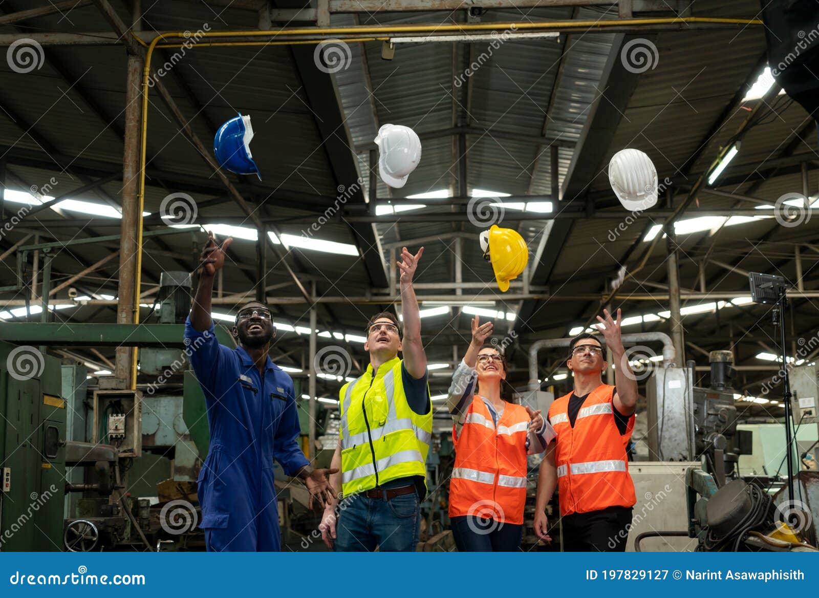 Group of Successful Multiethnic Engineer and Technician Worker Throwing ...