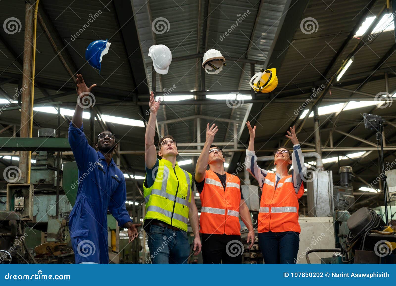 Group of Successful Multiethnic Engineer and Technician Worker Throwing ...