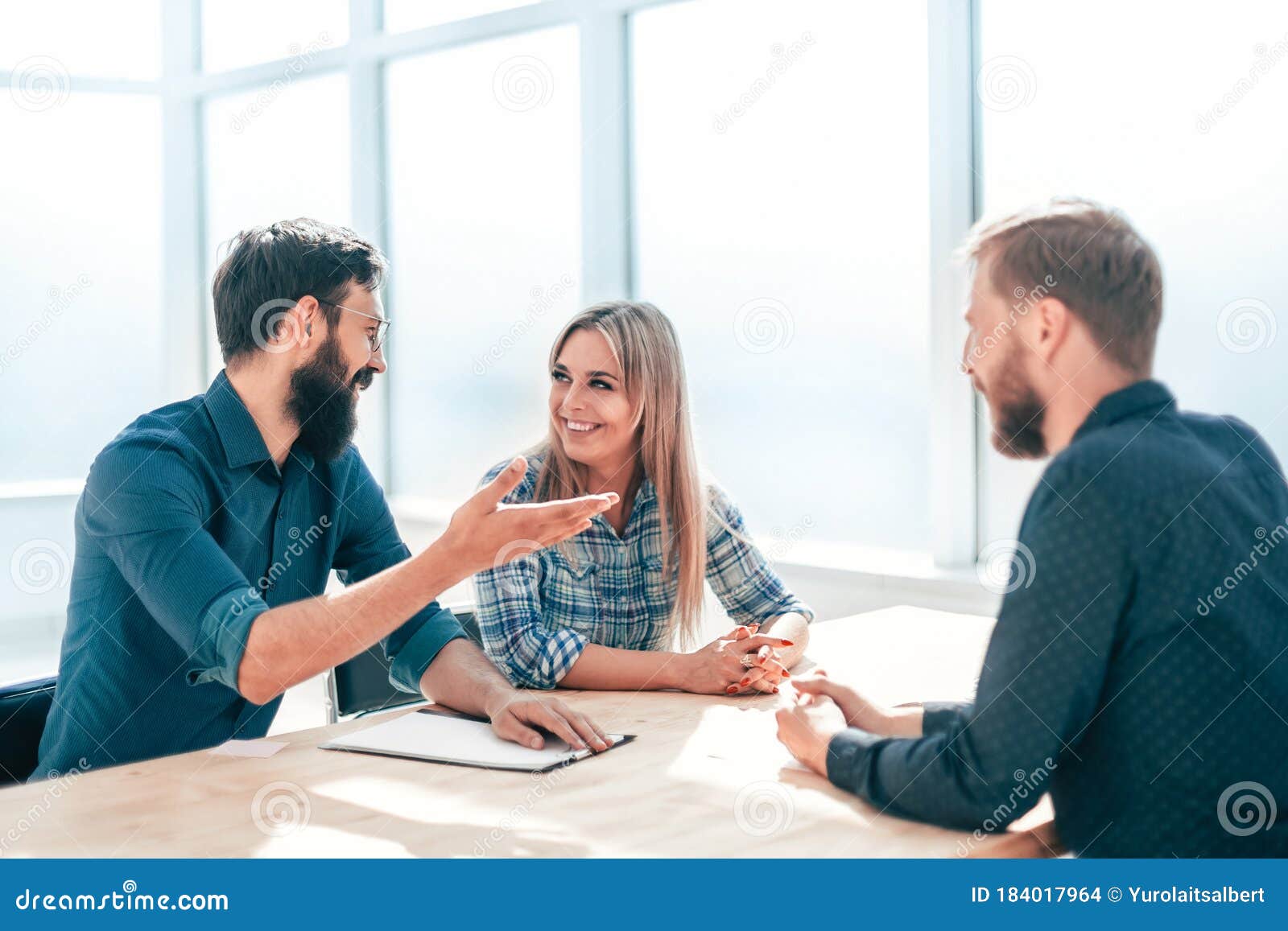 Group of Successful Young People Sitting at the Negotiating Table ...