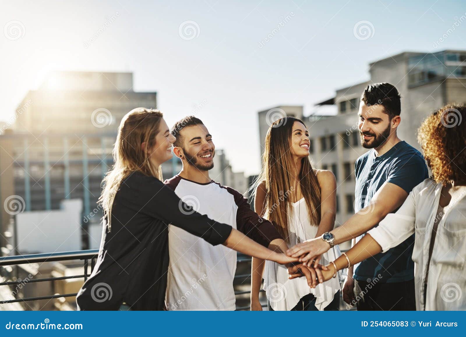 Group Support. a Group of Young People Putting Their Hands Together in ...